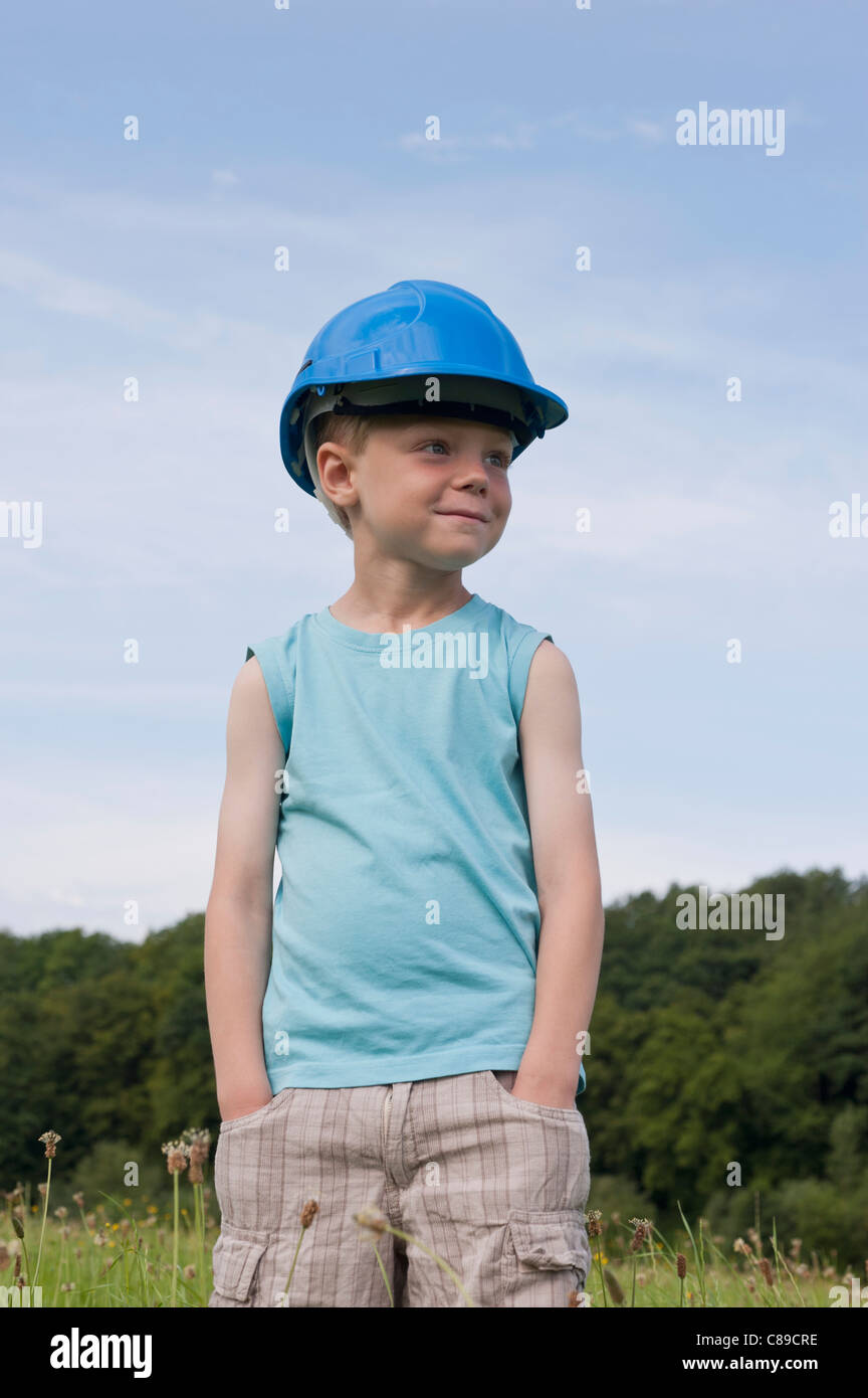 Germany, North Rhine-Westphalia, Hennef, Boy with construction worker ...