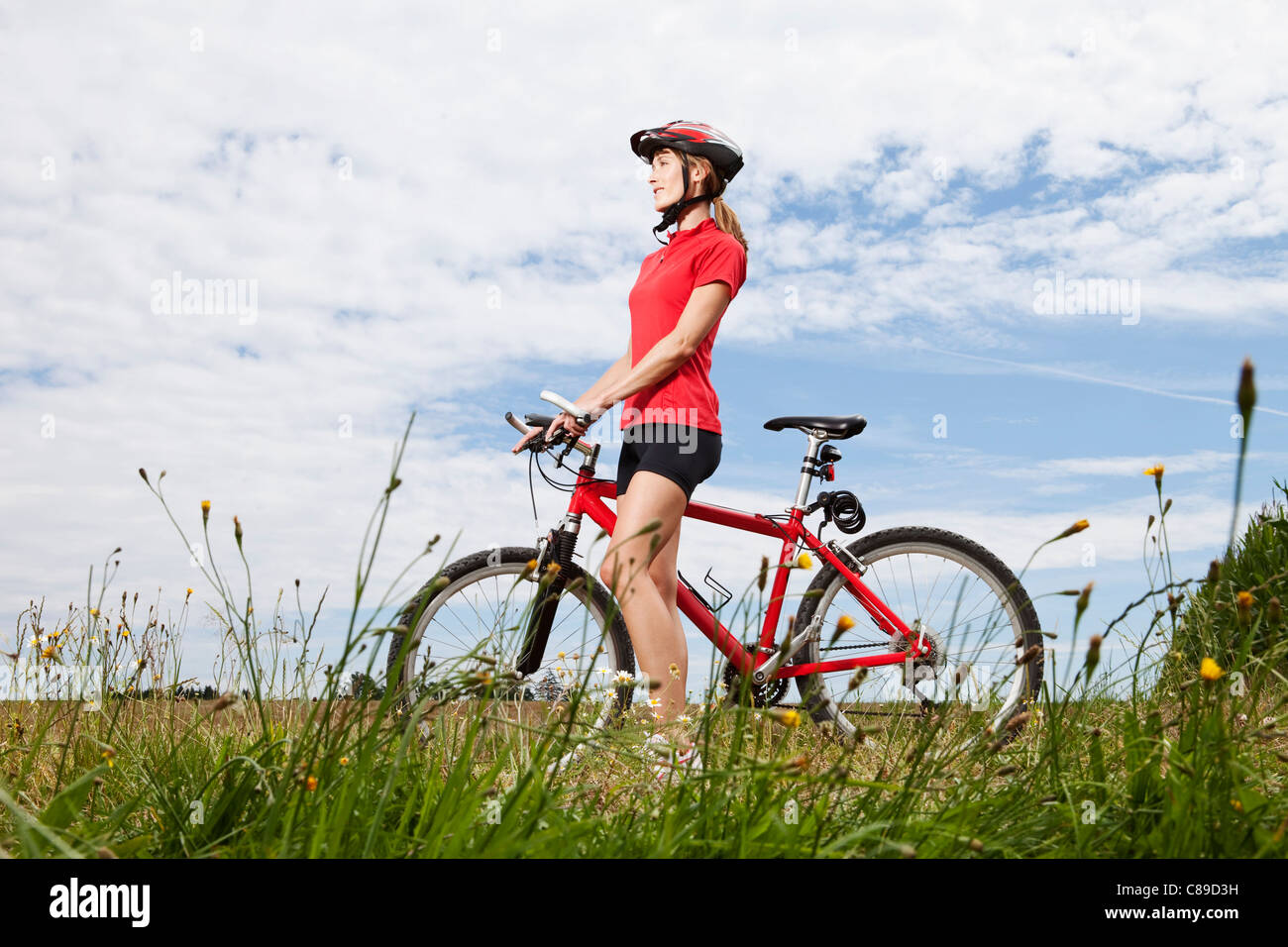 Female biker walking mountain hi-res stock photography and images - Alamy