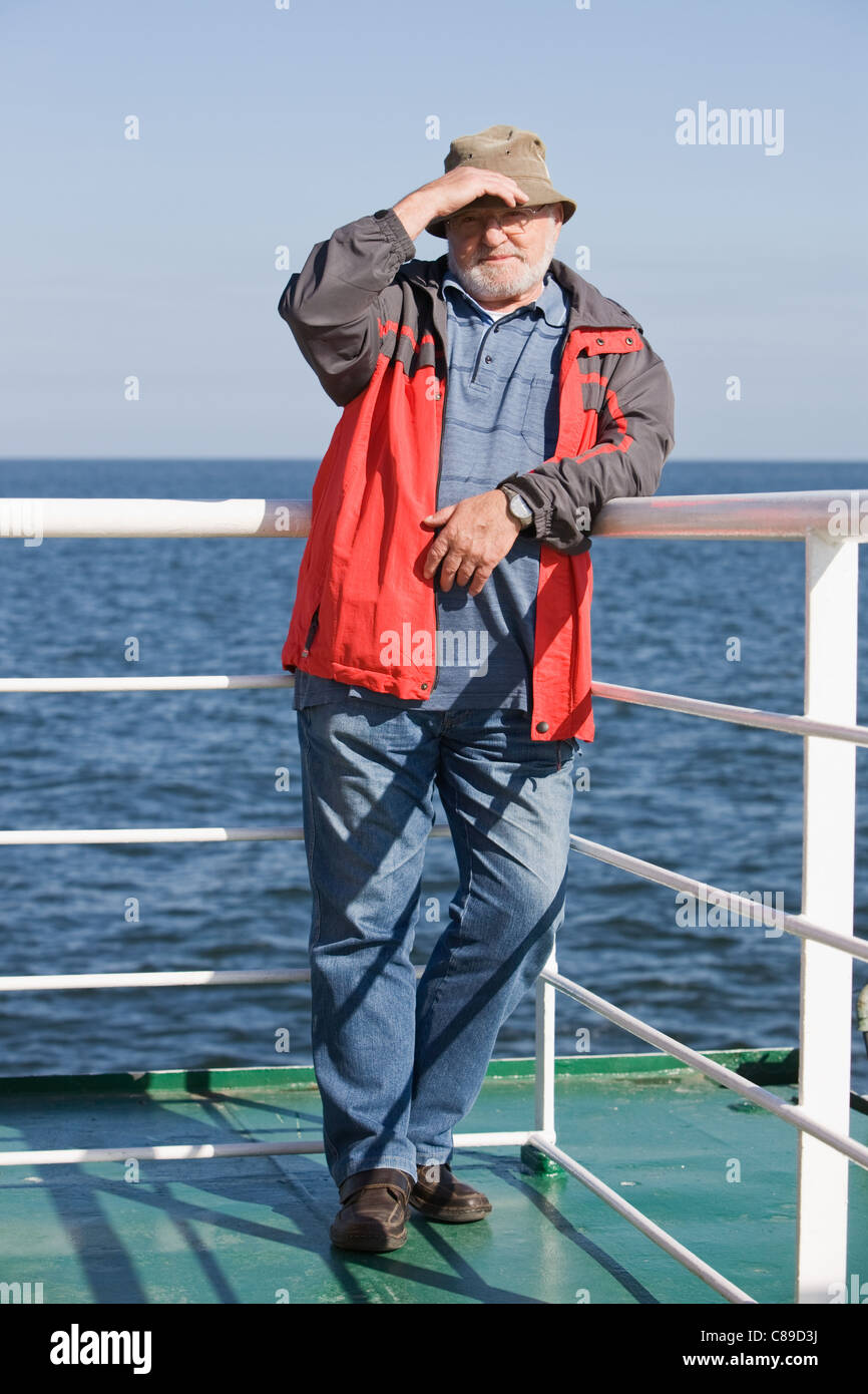 Railing standing nautical vessel transportation smiling hi-res stock ...