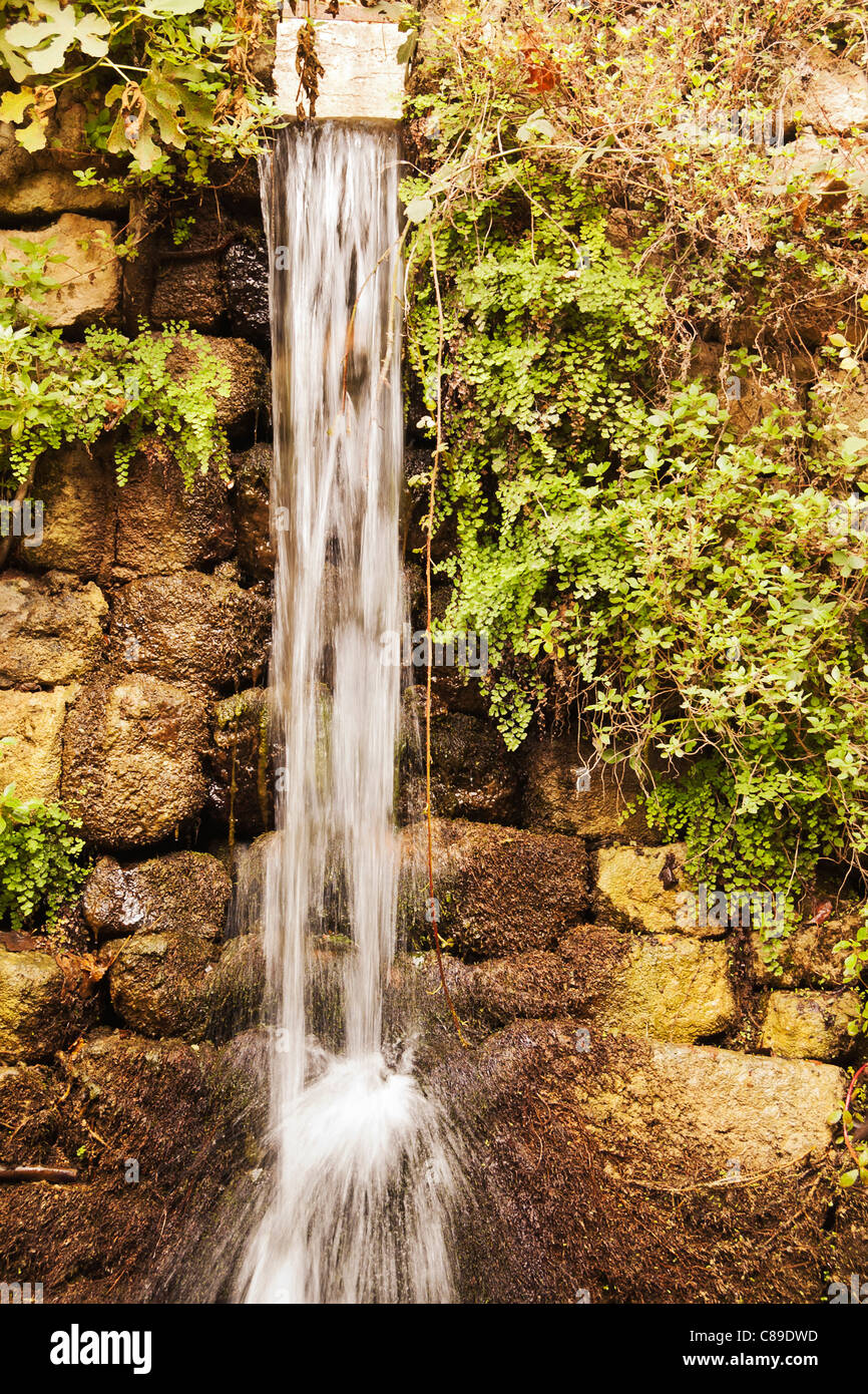 water flowing from a traditional irrigation channel Stock Photo - Alamy