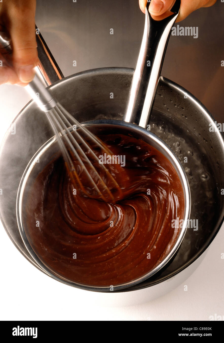Melted chocolate in a bain-marie Stock Photo - Alamy