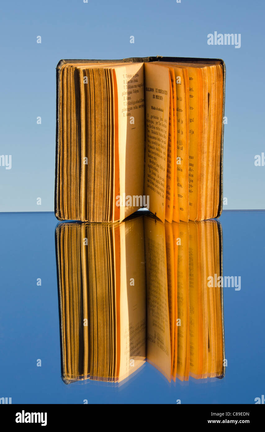 old book on mirror and reflection on sky background Stock Photo - Alamy