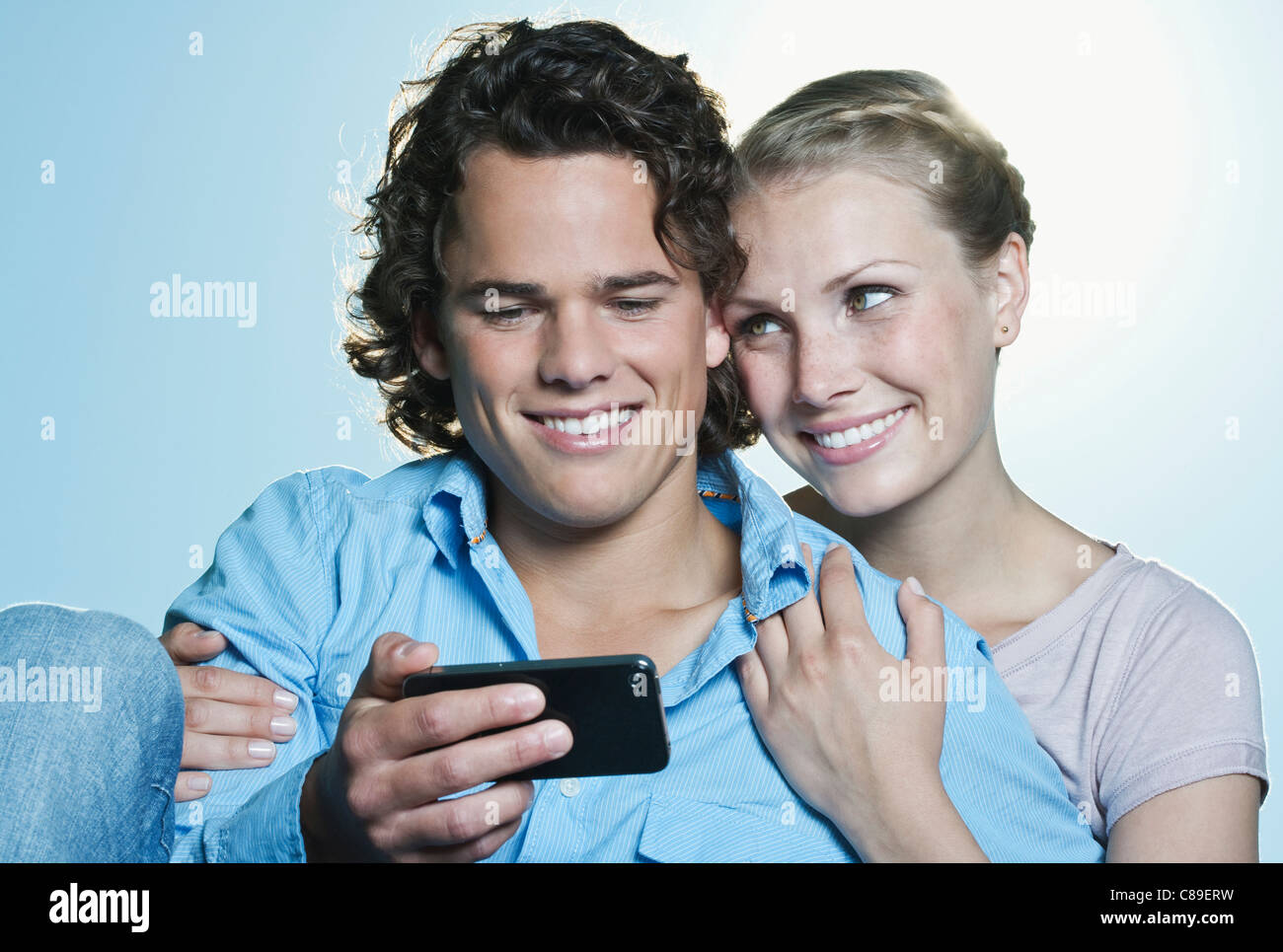 Italy, Tuscany, Close up of young couple, man using cell phone Stock ...