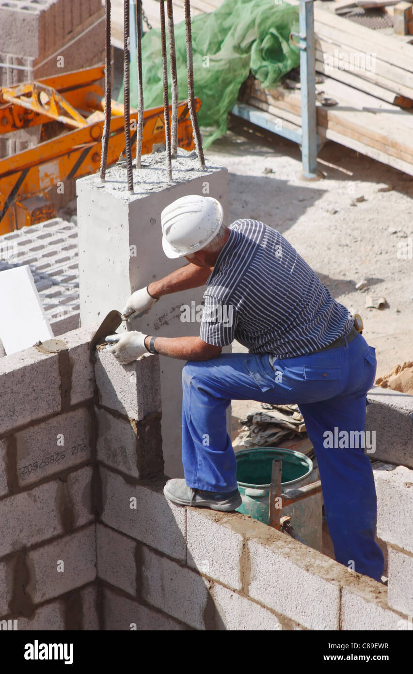 Construction worker building new house on Gran Canaria, Canary Islands ...