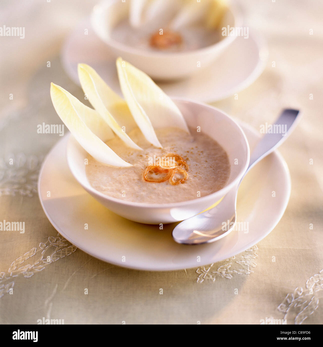 Creamed chicory with shallots in beer Stock Photo - Alamy