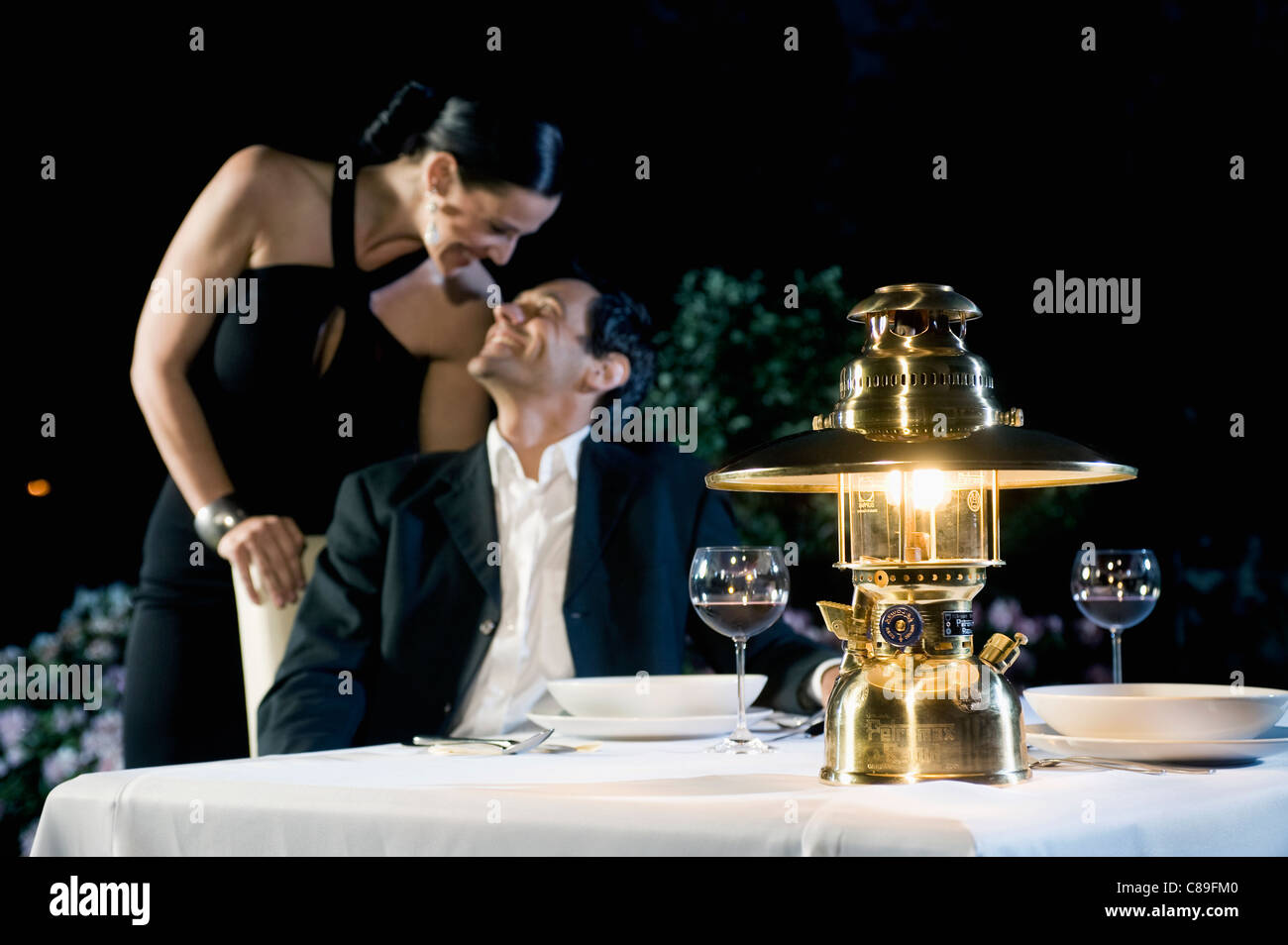 Couple romancing on table hi-res stock photography and images - Alamy