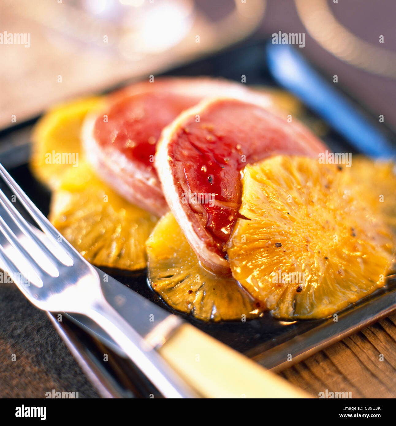 Slices of roast ostrich with pineapple Stock Photo - Alamy