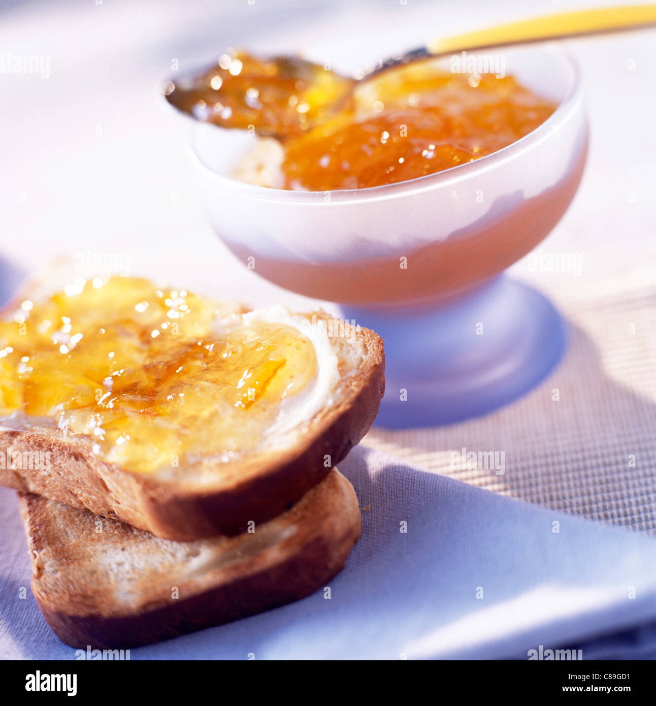 Orange jam and slices of bread and jam Stock Photo - Alamy
