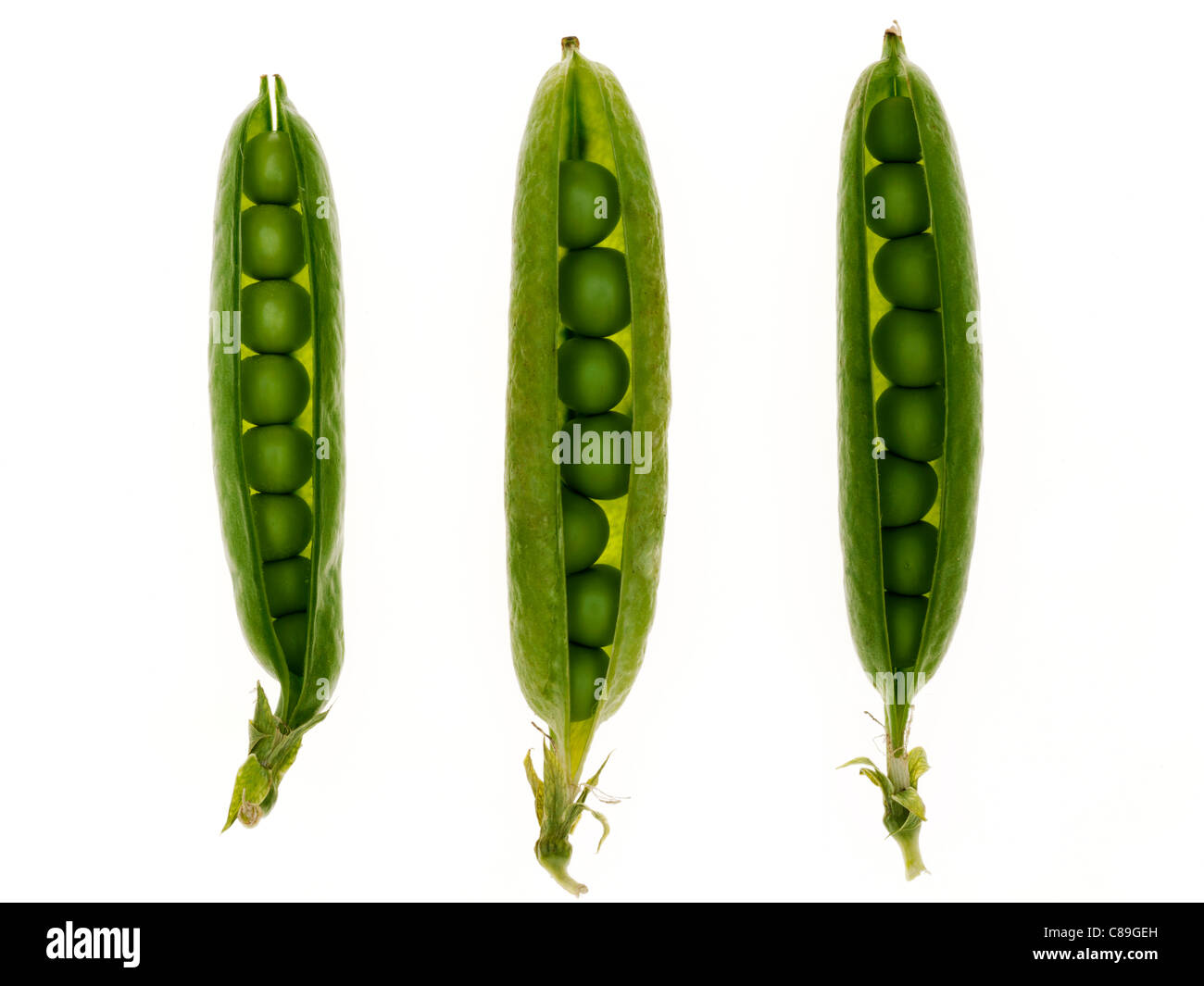 Peas in their pods Stock Photo - Alamy