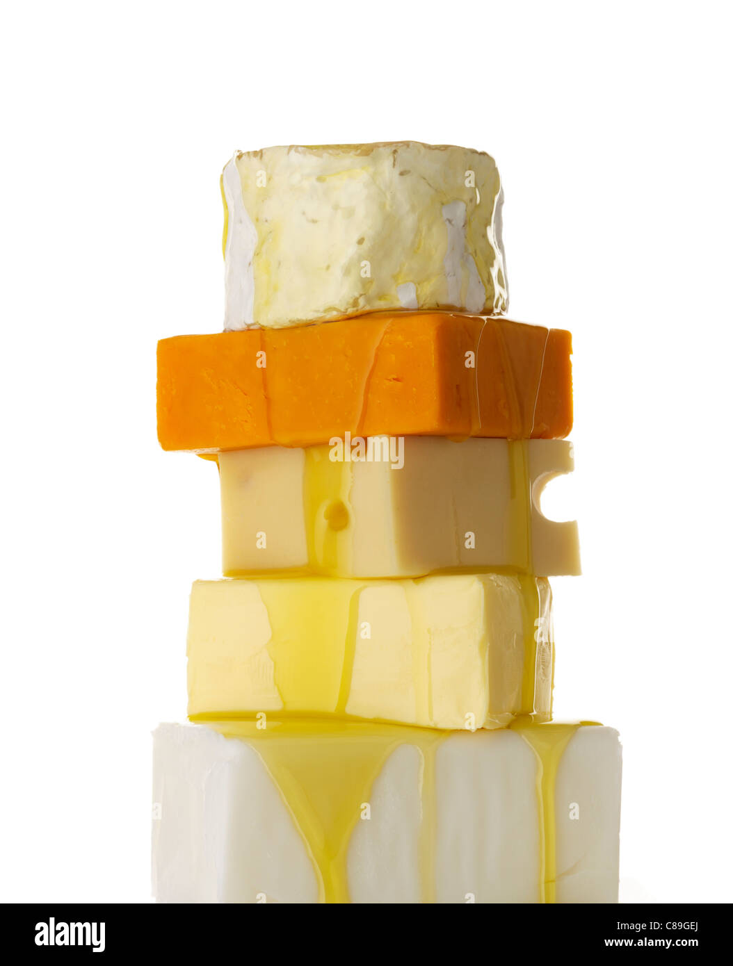 Pouring oil over a stack of cheese Stock Photo - Alamy