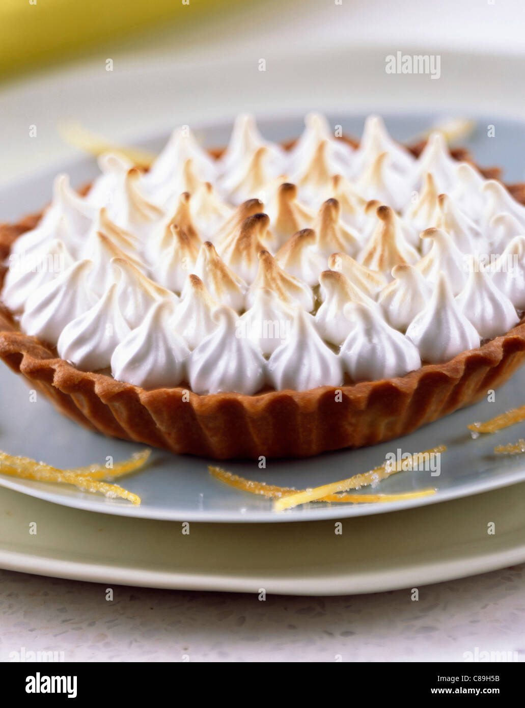Individual lemon meringue tart Stock Photo - Alamy