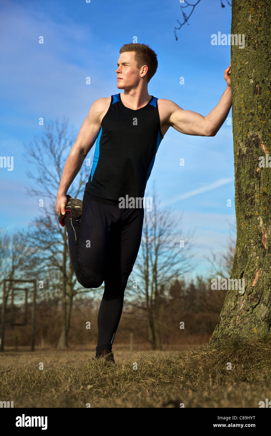 Man pose against tree hi-res stock photography and images - Alamy