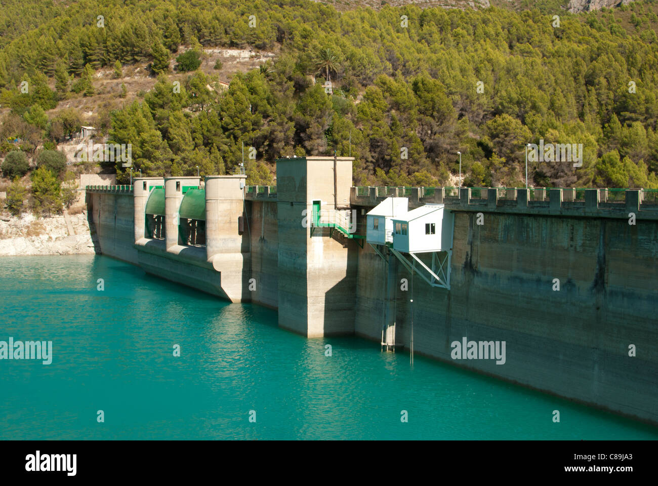 Reservoir dam with low water level, leaving a big part of the structure ...