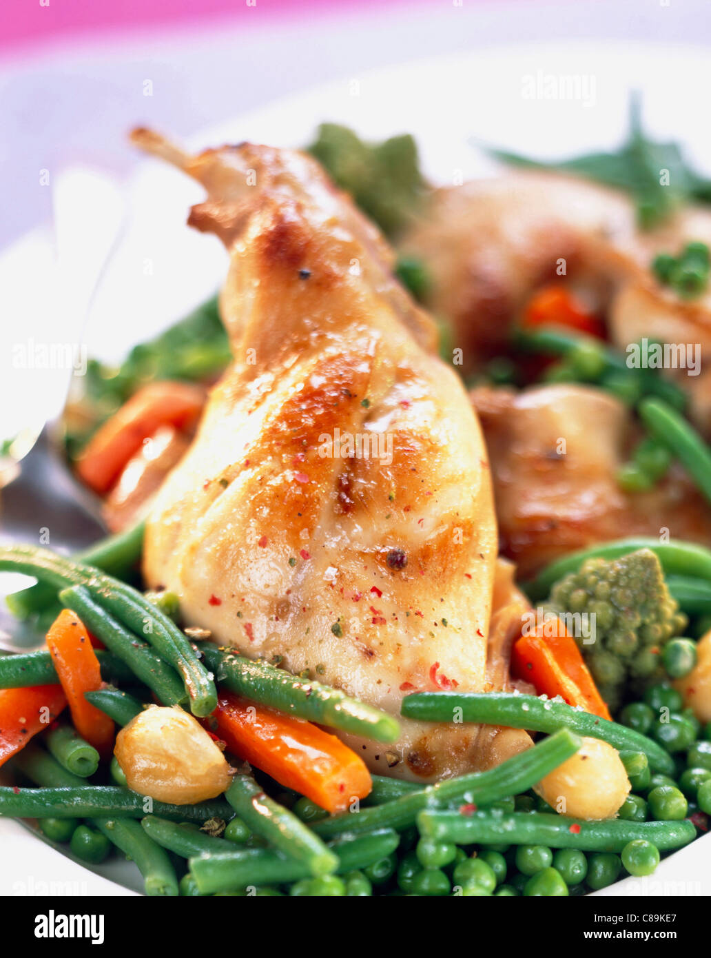 Roast rabbit with peas, carrots and green beans Stock Photo - Alamy