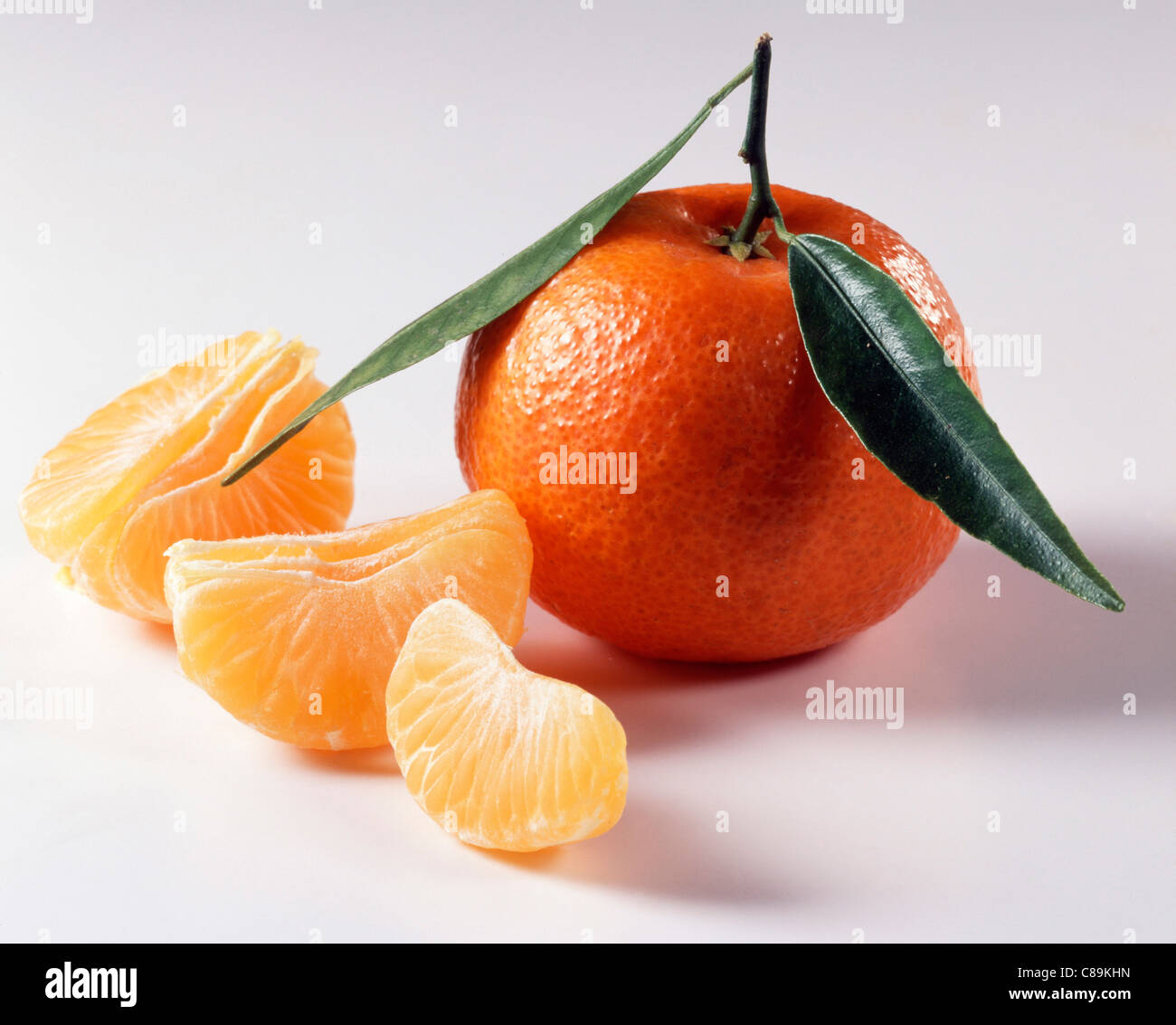 Whole mandarine and segments Stock Photo - Alamy