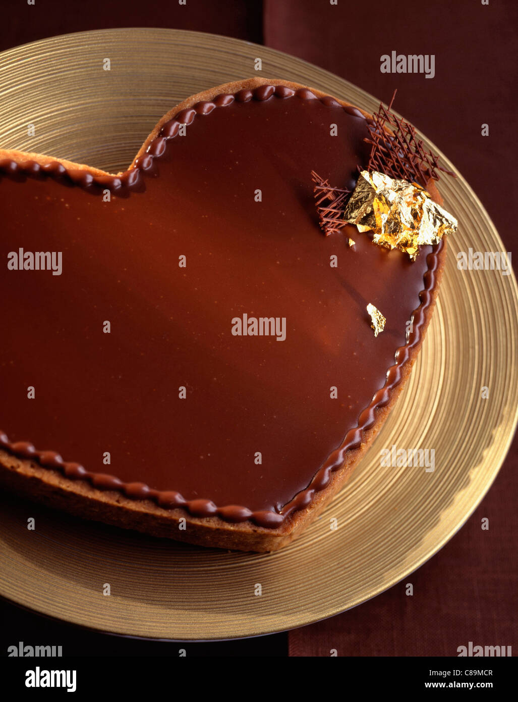 Heart-shaped chocolate tart Stock Photo - Alamy