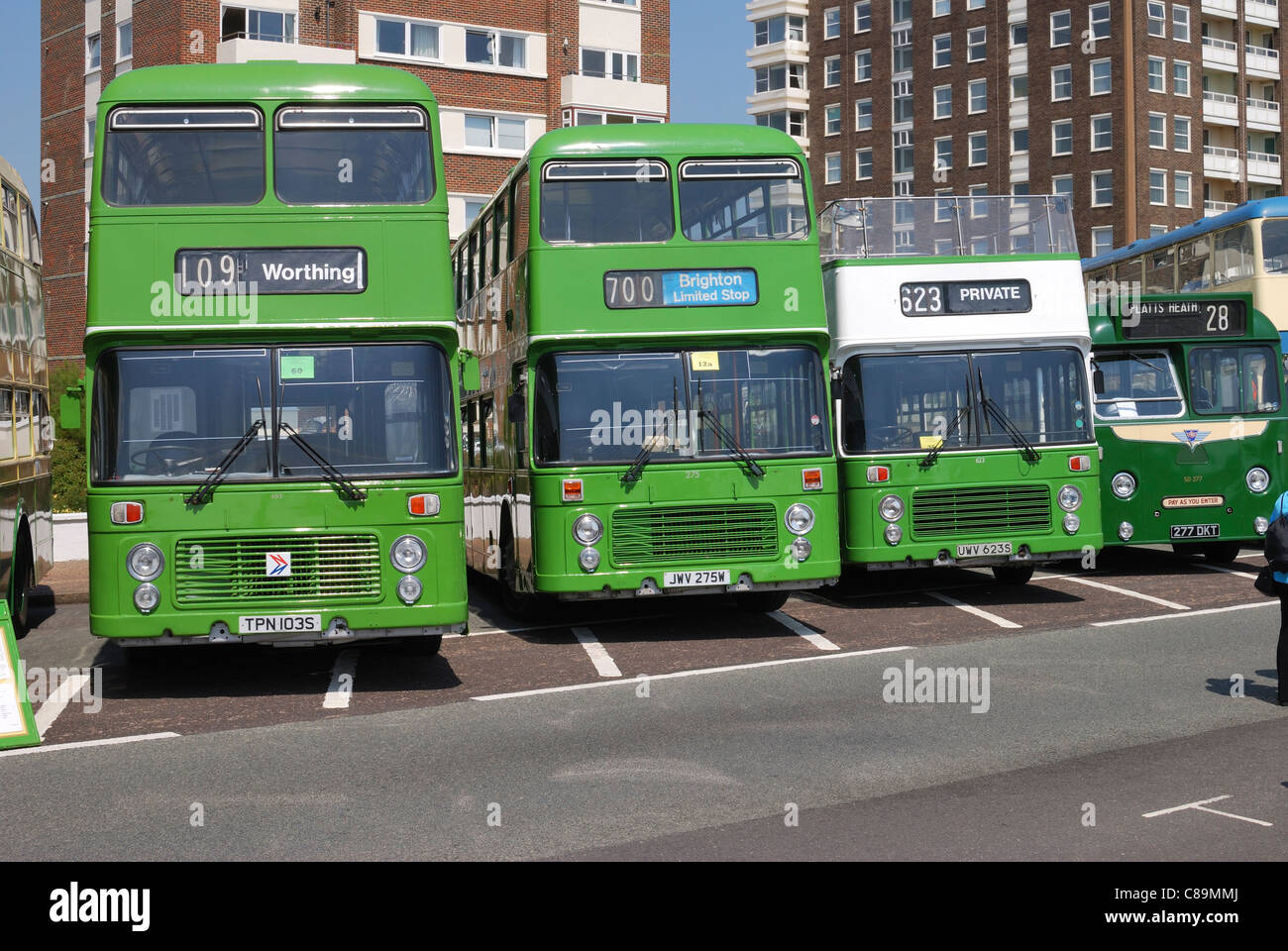 Line of green double decker buses on seafront at Worthing. West Sussex ...