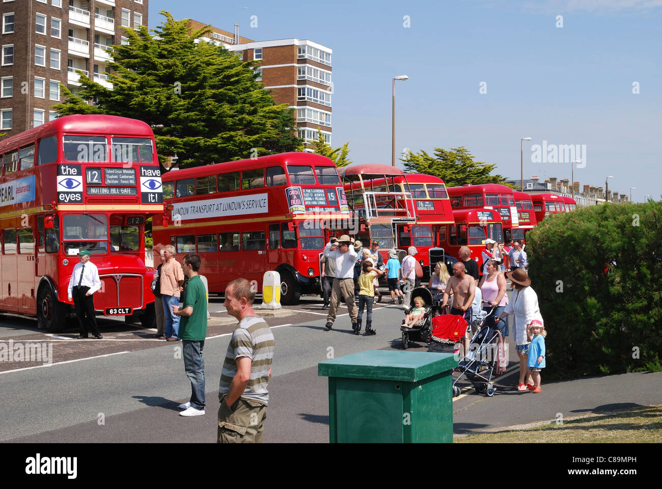 Line of red double decker buses on seafront at Worthing. West Sussex ...
