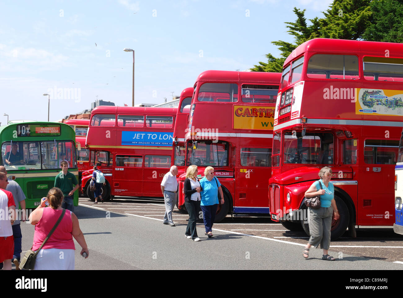 Line of red double decker buses on seafront at Worthing. West Sussex ...