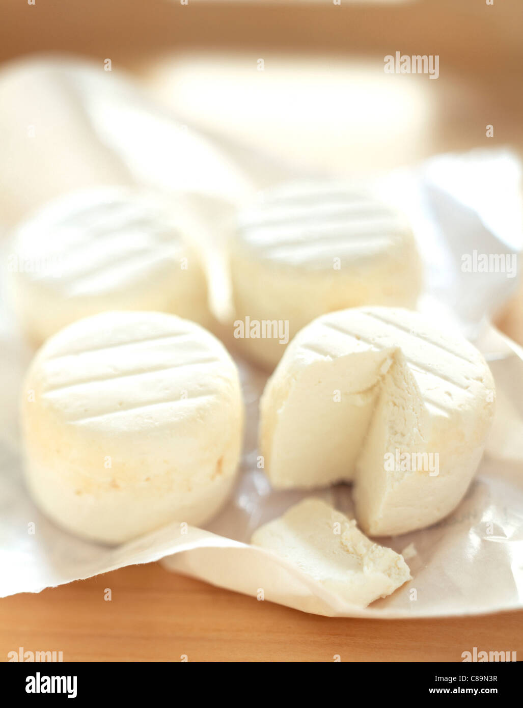 Small fresh goat's cheeses Stock Photo - Alamy