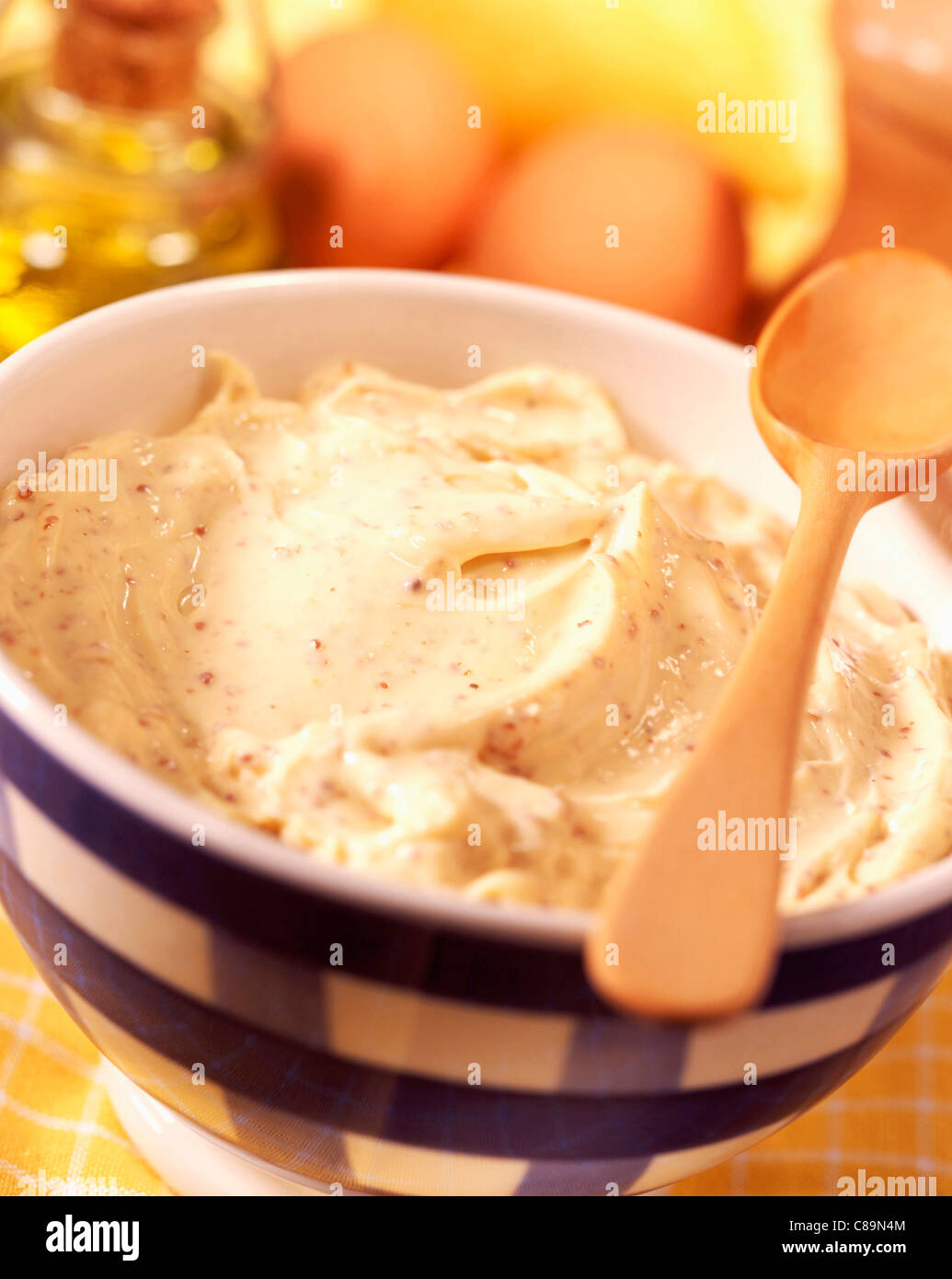 Bowl of mayonnaise and wooden spoon Stock Photo - Alamy