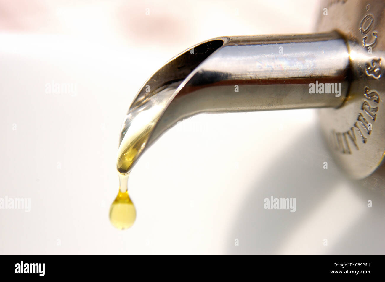 Dripping olive oil Stock Photo - Alamy