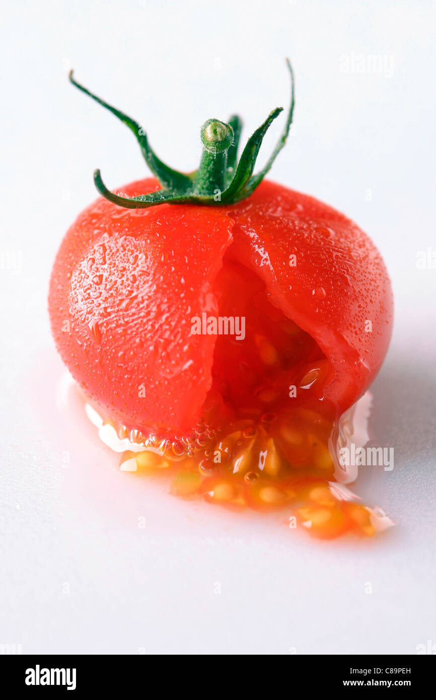Split cherry tomato Stock Photo - Alamy