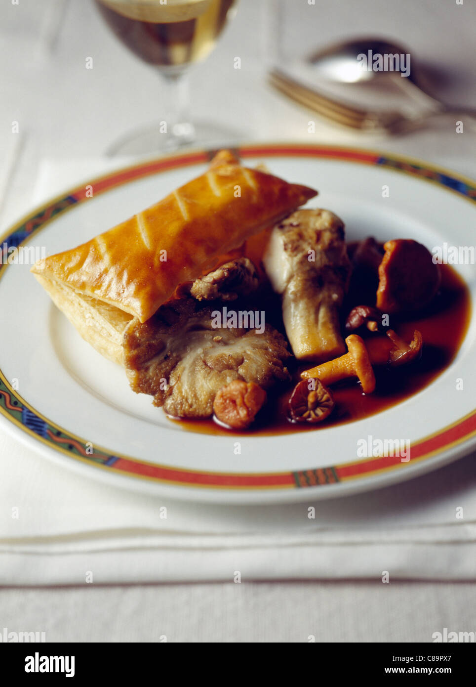 Brains puff pastry pie,marrow,chanterelles and mousserons Stock Photo ...