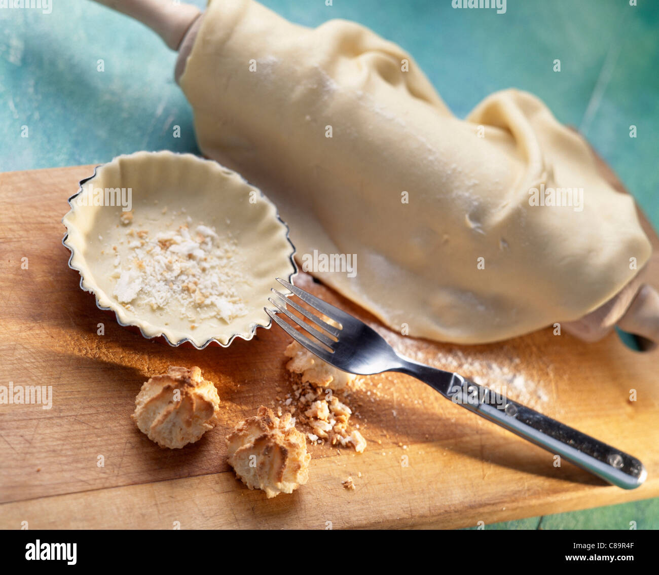 Pastry dough, tart tin, rolling pin and fork Stock Photo - Alamy