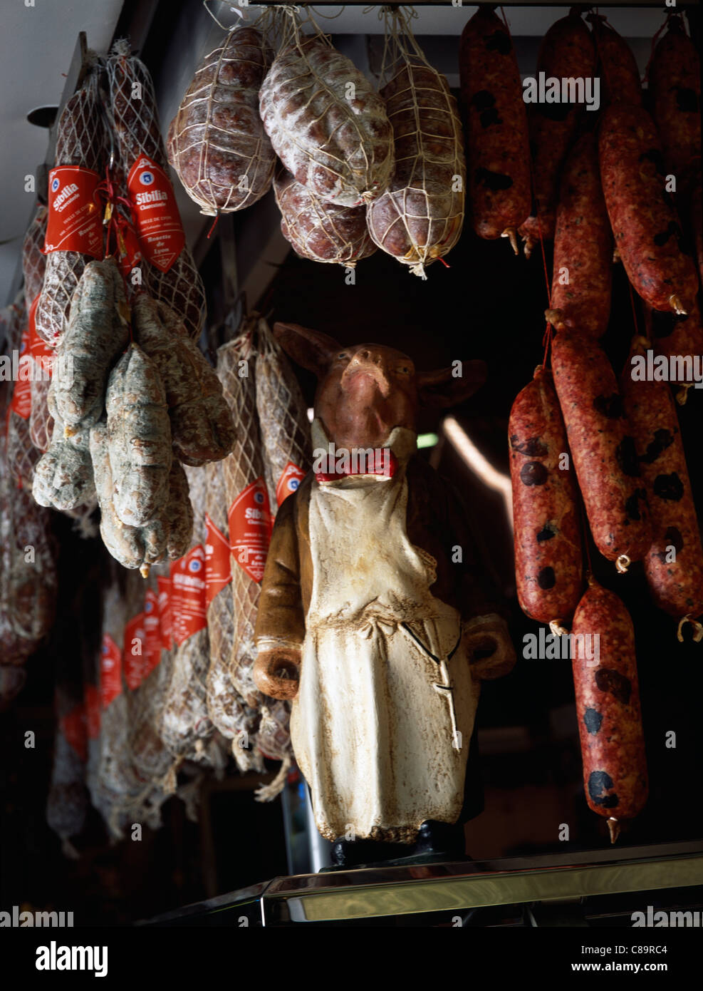 Cooked pork meats hanging Stock Photo - Alamy