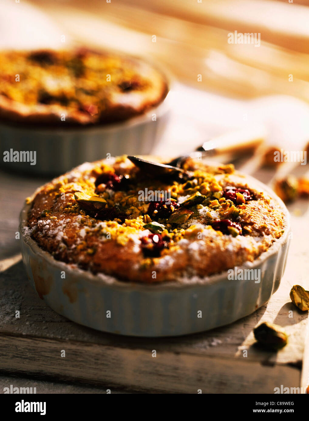 Pistachio and cherry batter pudding Stock Photo - Alamy