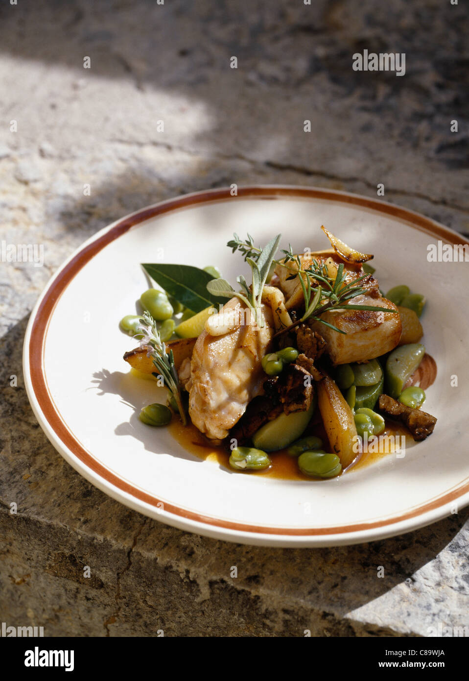 Provençal-style roast baby rabbit with sauteed potatoes Stock Photo - Alamy