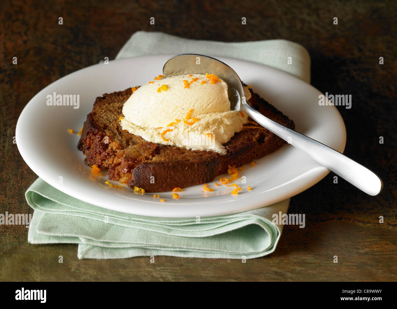 Slice of pan-fried gingerbread with vanilla ice cream and orange zests ...