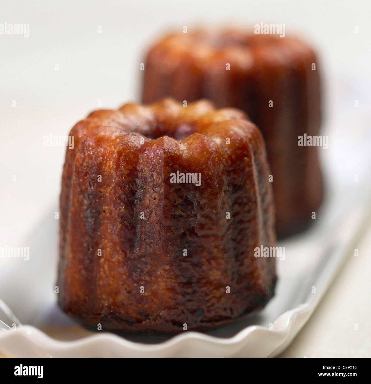 Caramelized crunchy cannelé cakes Stock Photo - Alamy