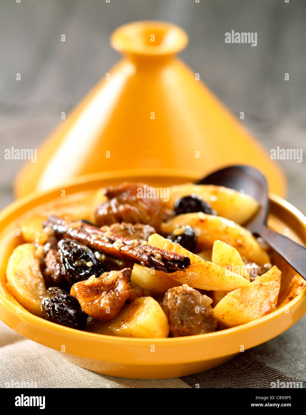 Lamb tajine with potatoes, dried fruit and saffron Stock Photo - Alamy