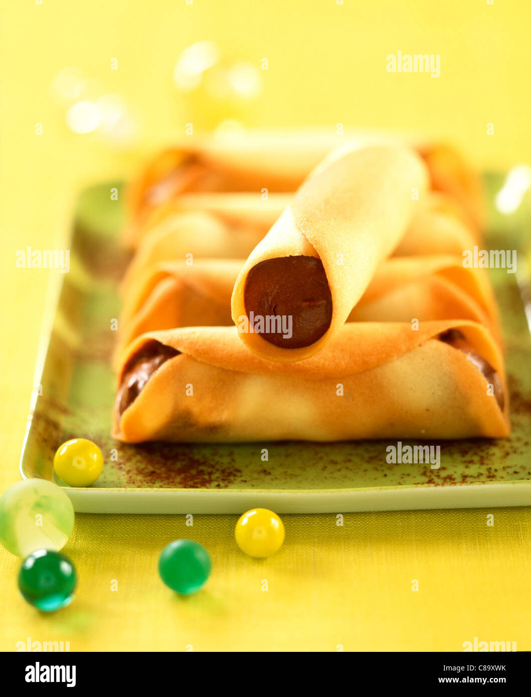 Chocolate filled cigar biscuits Stock Photo - Alamy