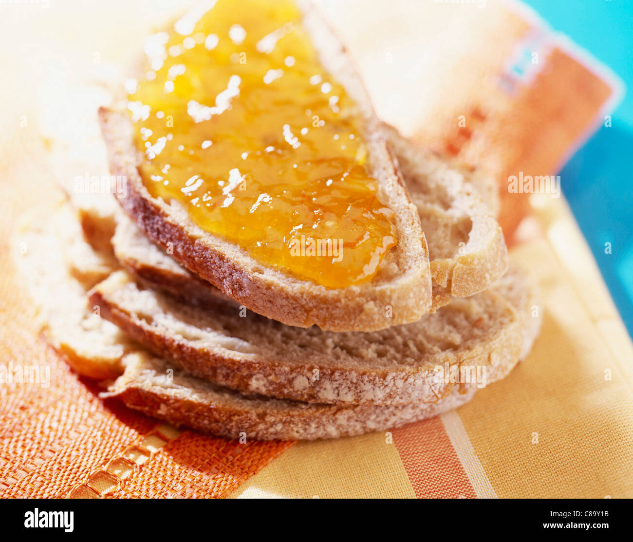 Orange marmalade on slices of bread Stock Photo - Alamy