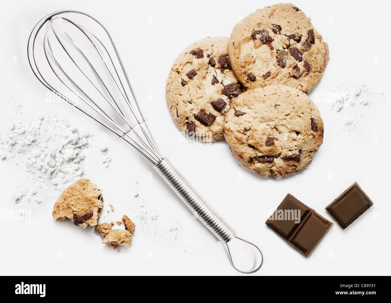 Chocolate chip cookies and whisk Stock Photo - Alamy