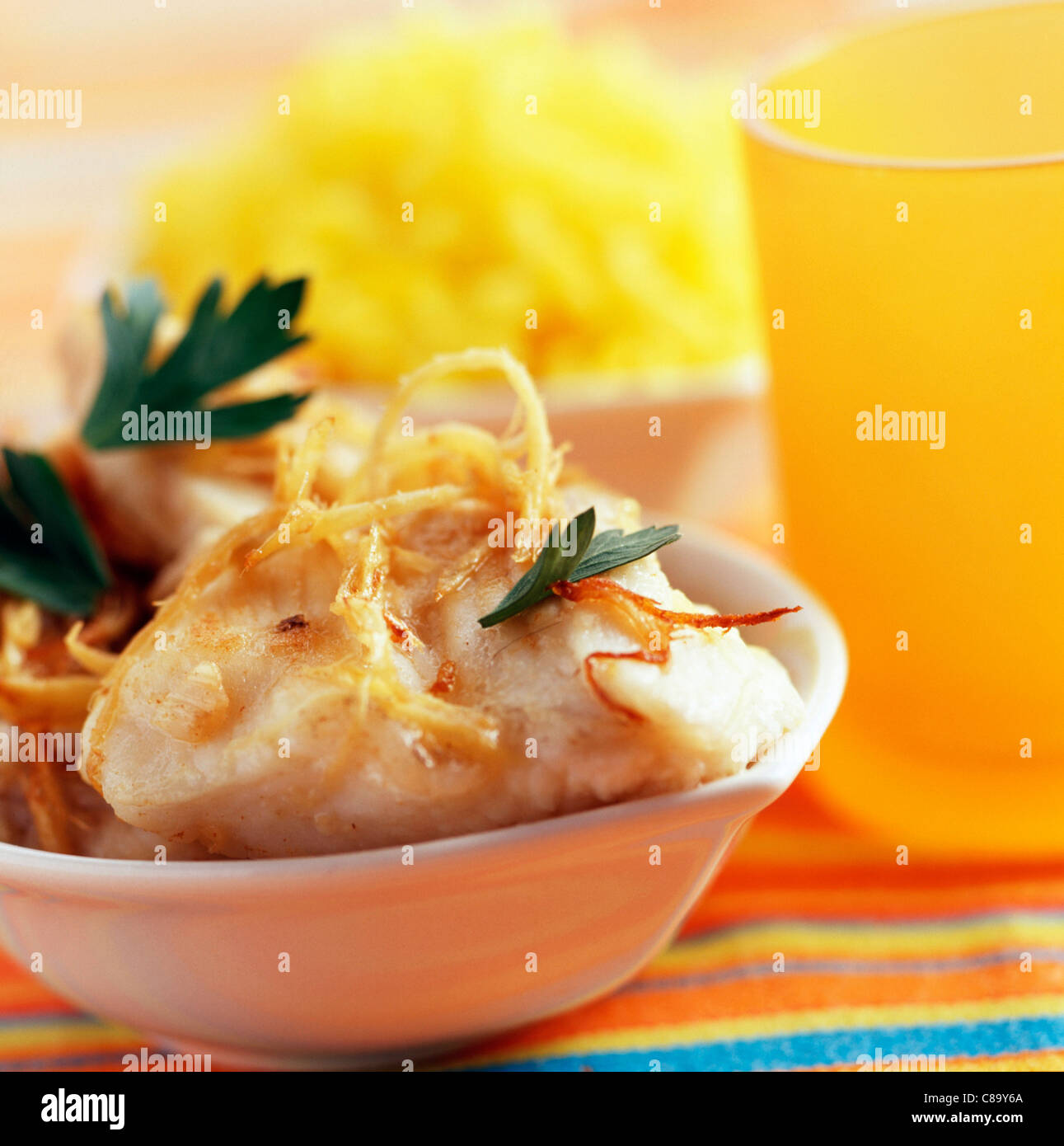 Monkfish with ginger and yellow rice Stock Photo - Alamy