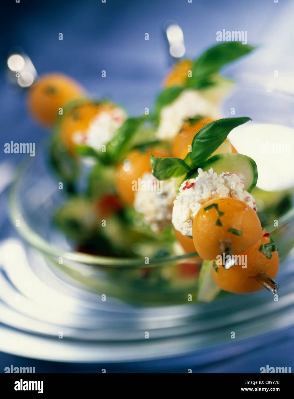 Melon and goat's cheese brochettes Stock Photo - Alamy