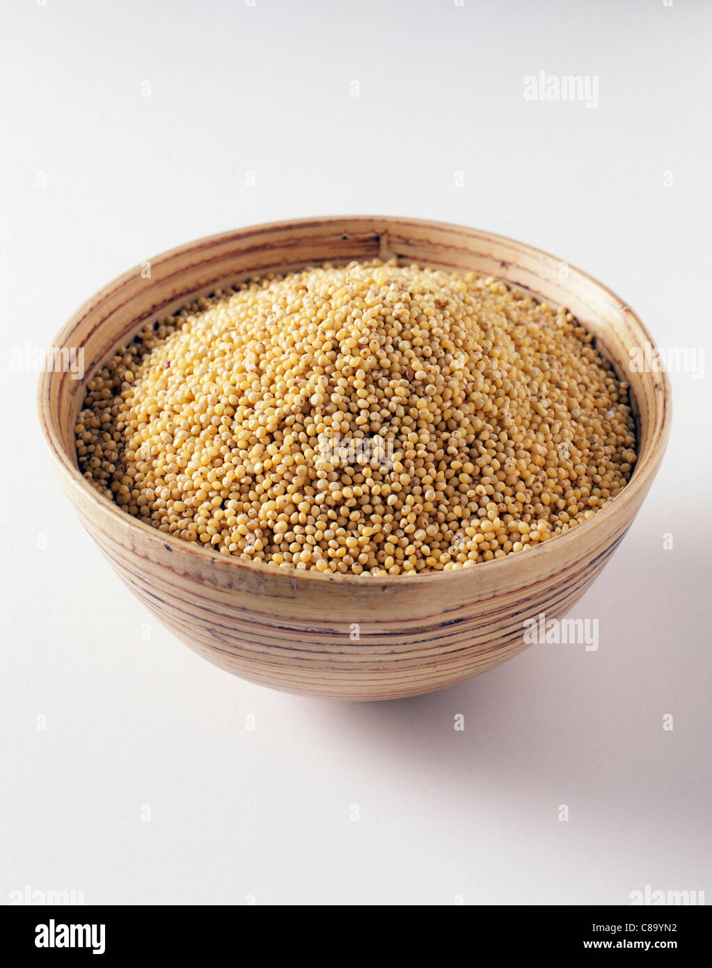 Millet in bowl Stock Photo - Alamy