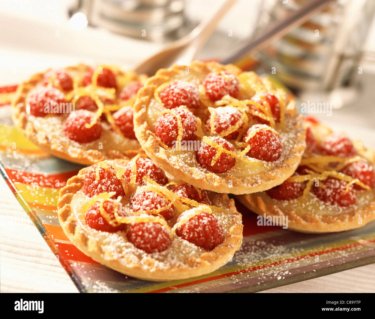 Mini raspberry tarts with lemon Stock Photo - Alamy