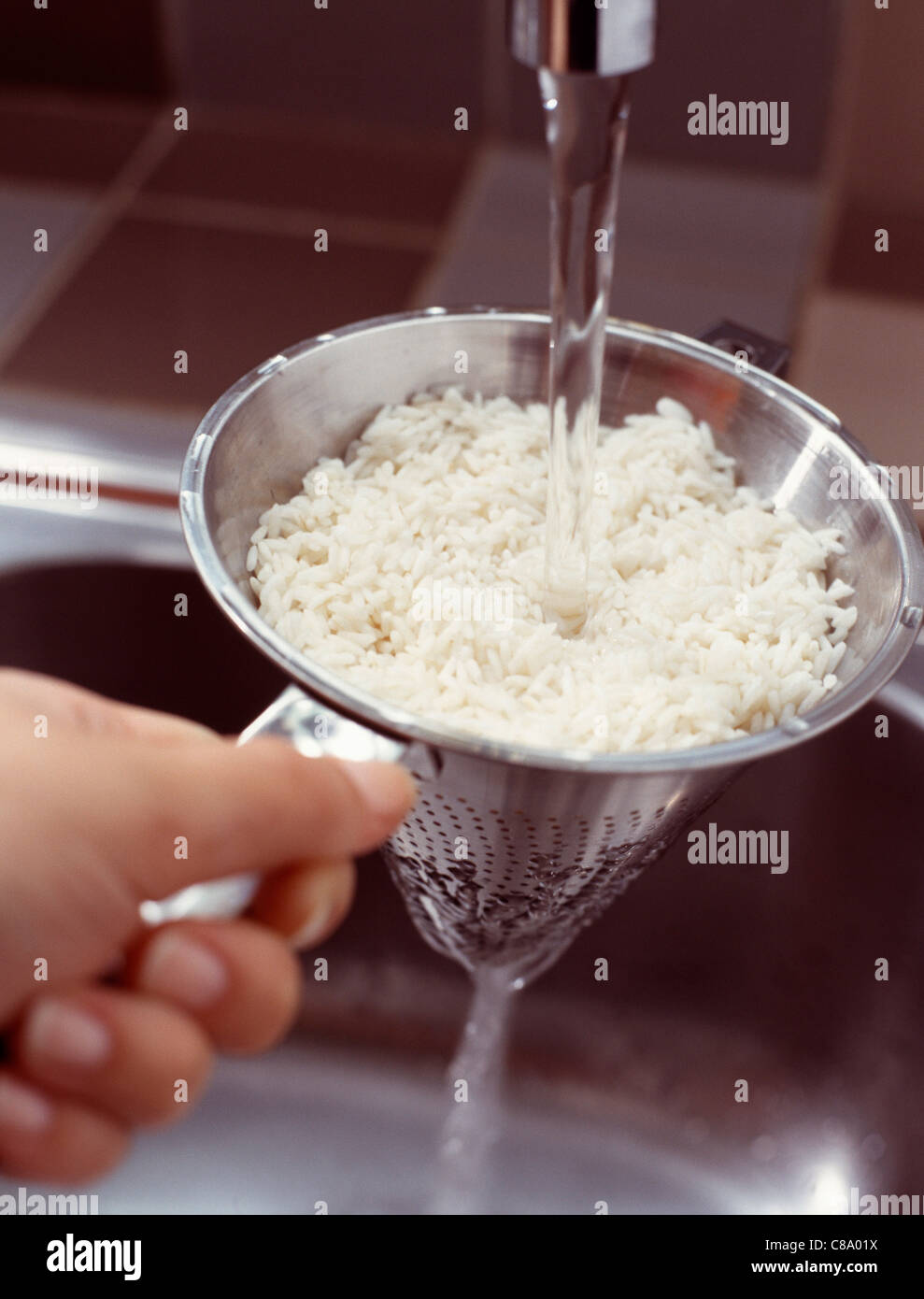 Rinsing rice hi-res stock photography and images - Alamy