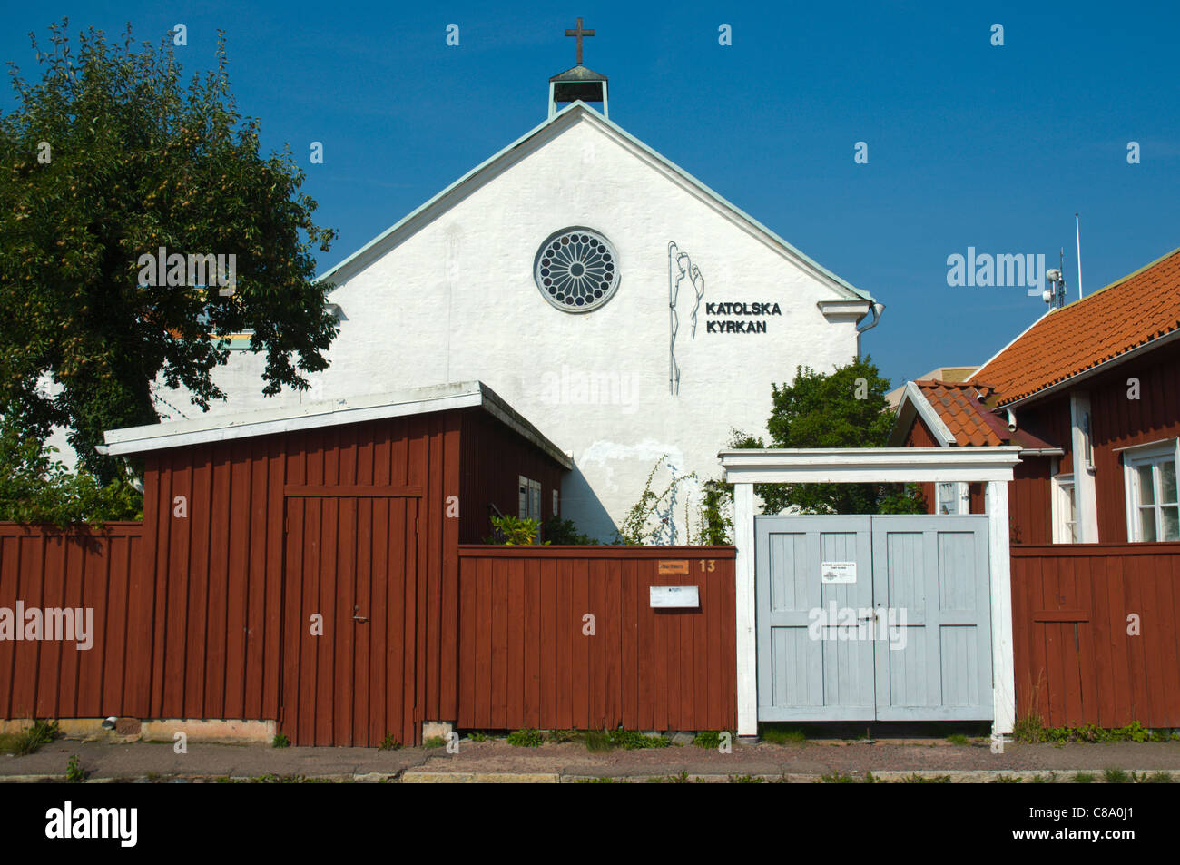 Catholic church exterior with red fence and house Kalmar city Småland ...