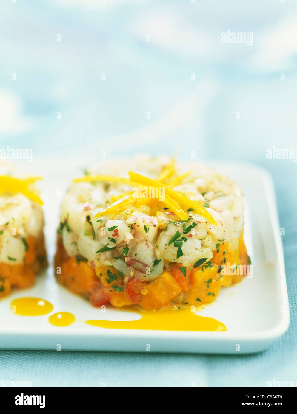 Scallop and yellow pepper tartare with mango puree Stock Photo - Alamy