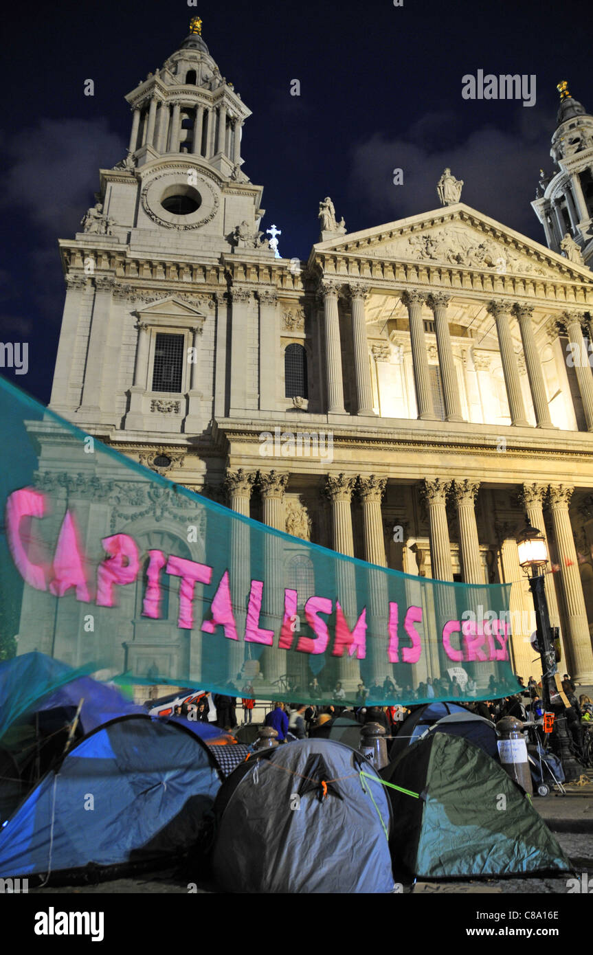Capitalism is Crisis banner the courtyard of St Paul's Cathedral as ...