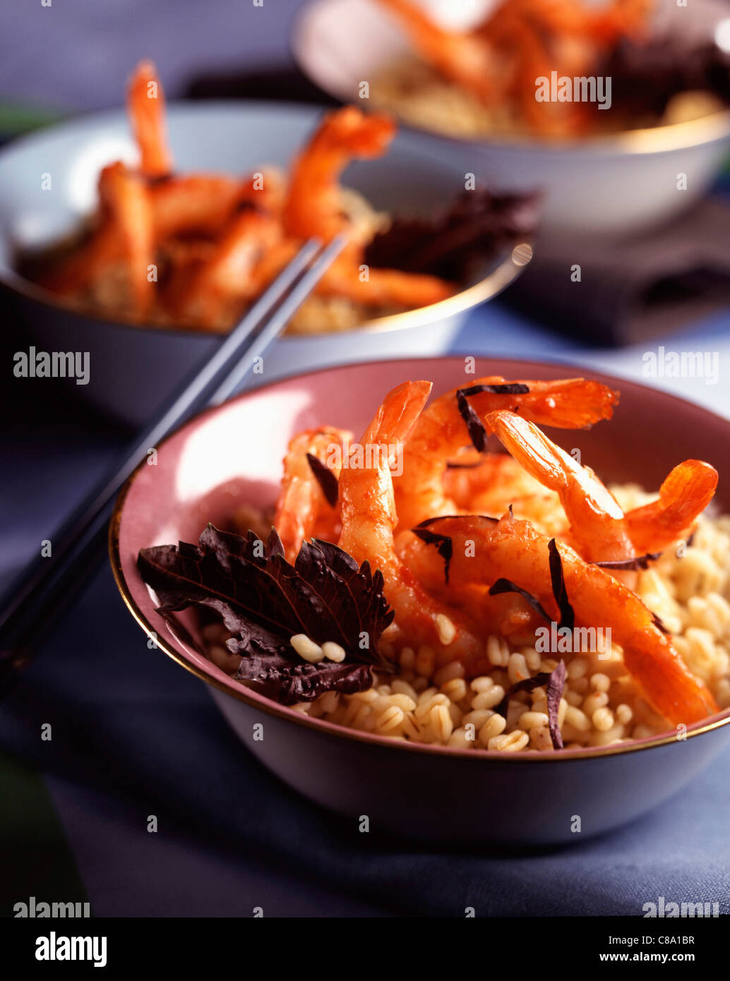 Prawns in tomato sauce with cracked wheat Stock Photo - Alamy