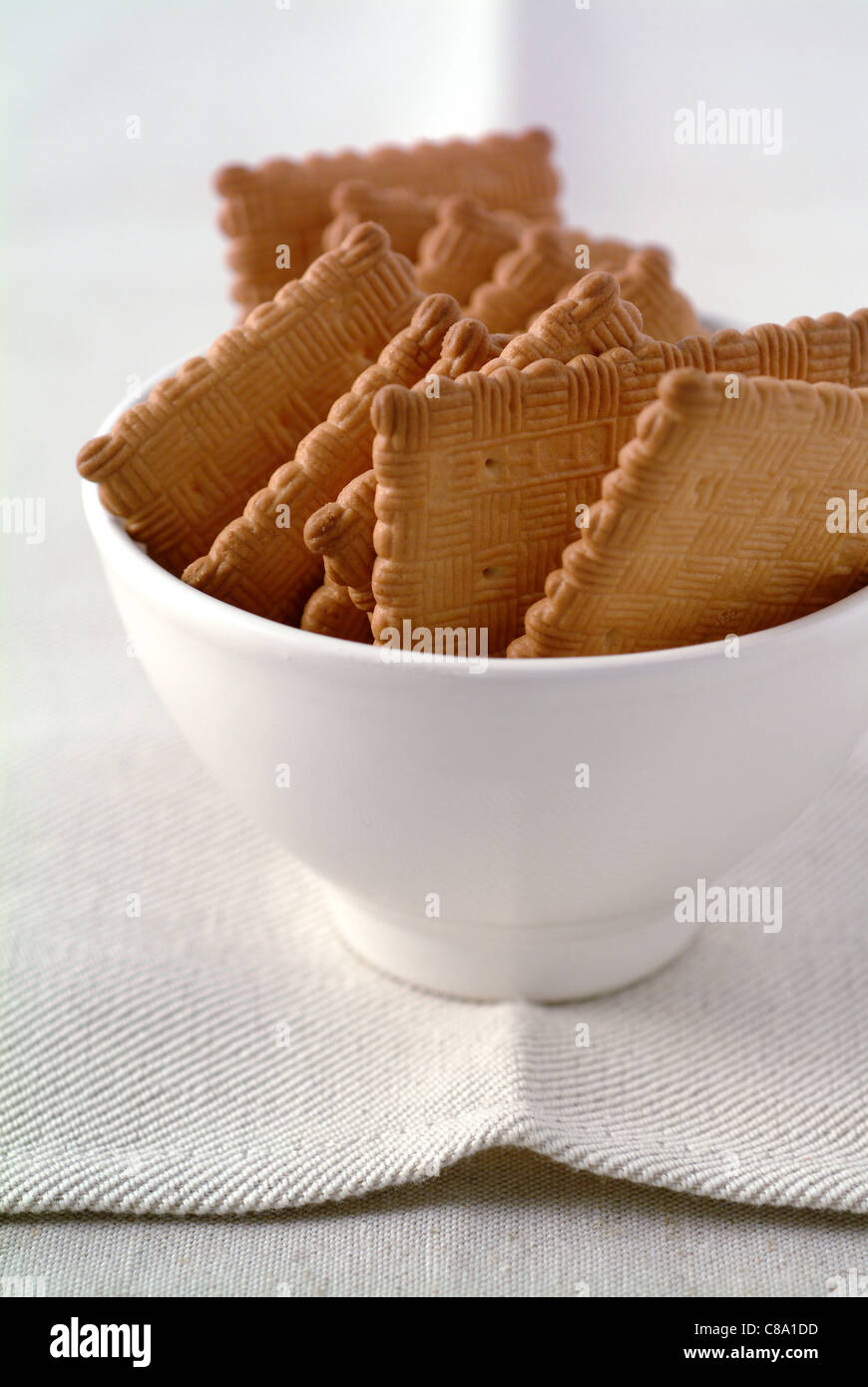 Square biscuits in bowl Stock Photo - Alamy
