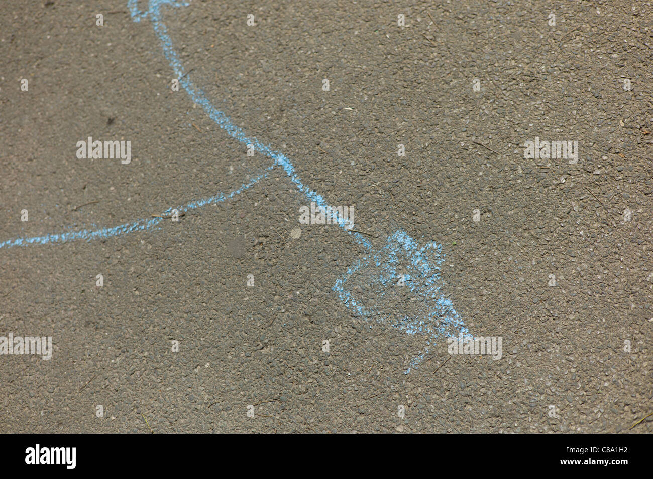 Child's chalk drawing on pavement or path in park playground Stock ...