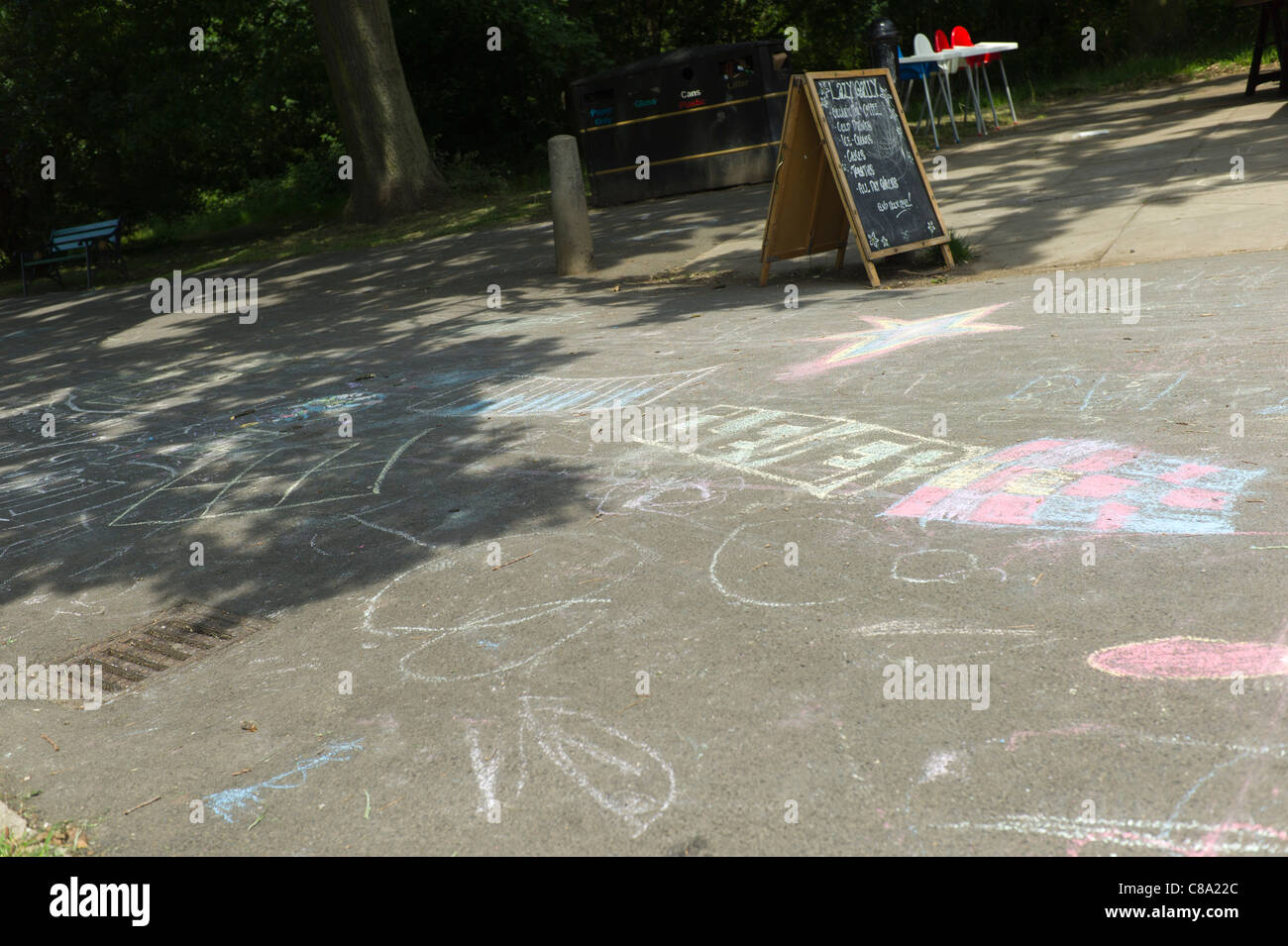 Child's chalk drawing on pavement or path in park playground Stock ...